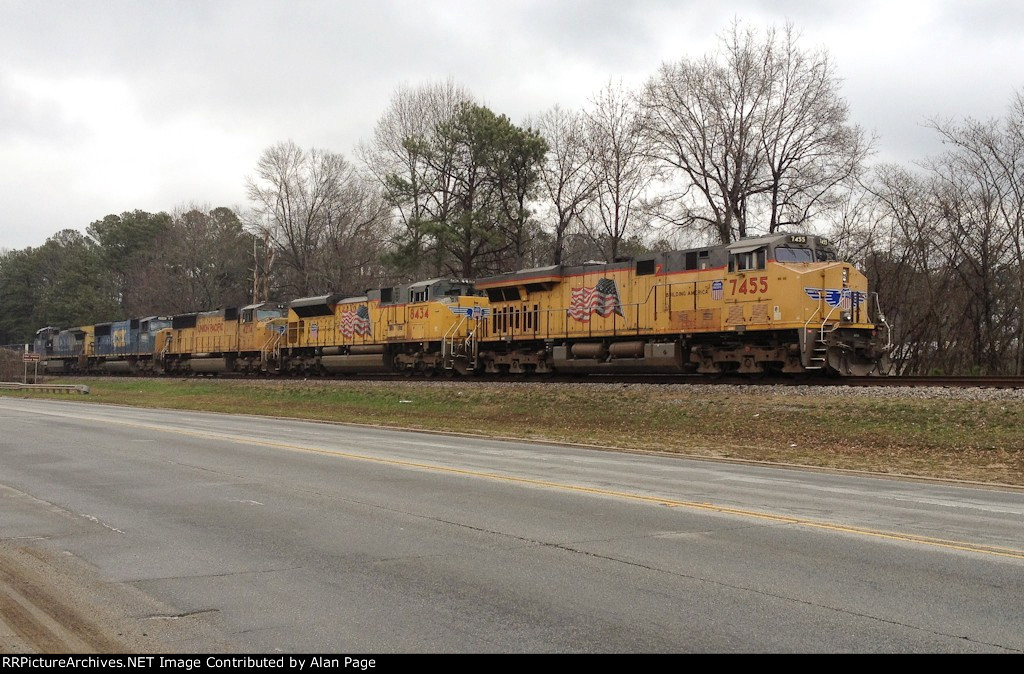 UP 7455, 8434, and 4274 and CSX 4689 and 7650 pause for the signal